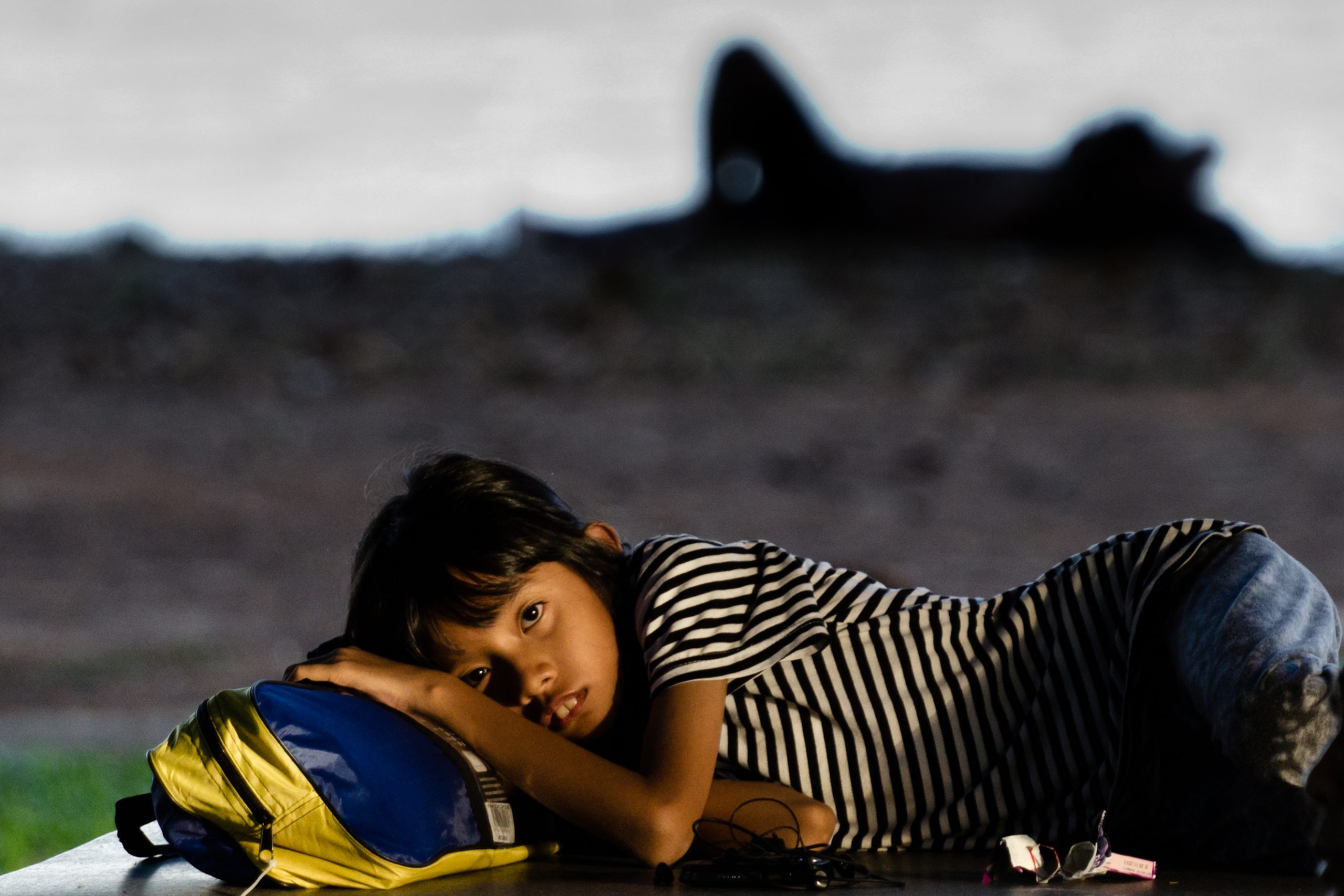 Singapore,-,May,2011:,An,Unidentified,Girl,Lays,On,Her - Humanium