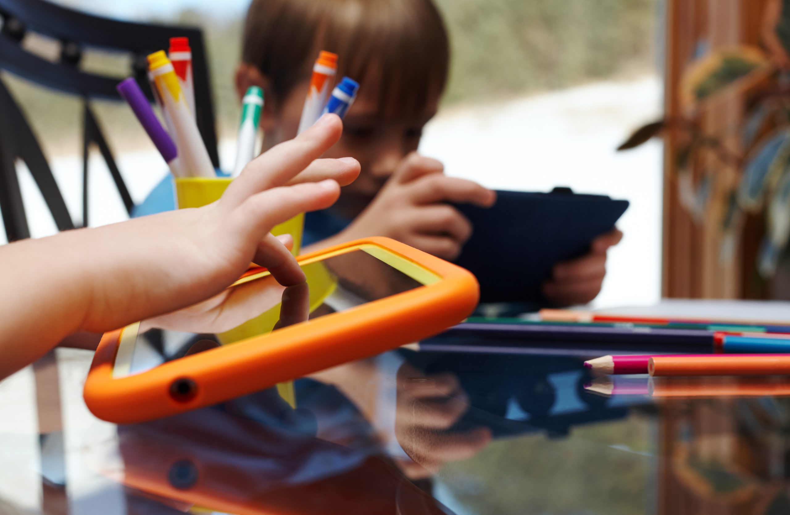 Children,Playing,On,Digital,Tablet,At,Home - Humanium