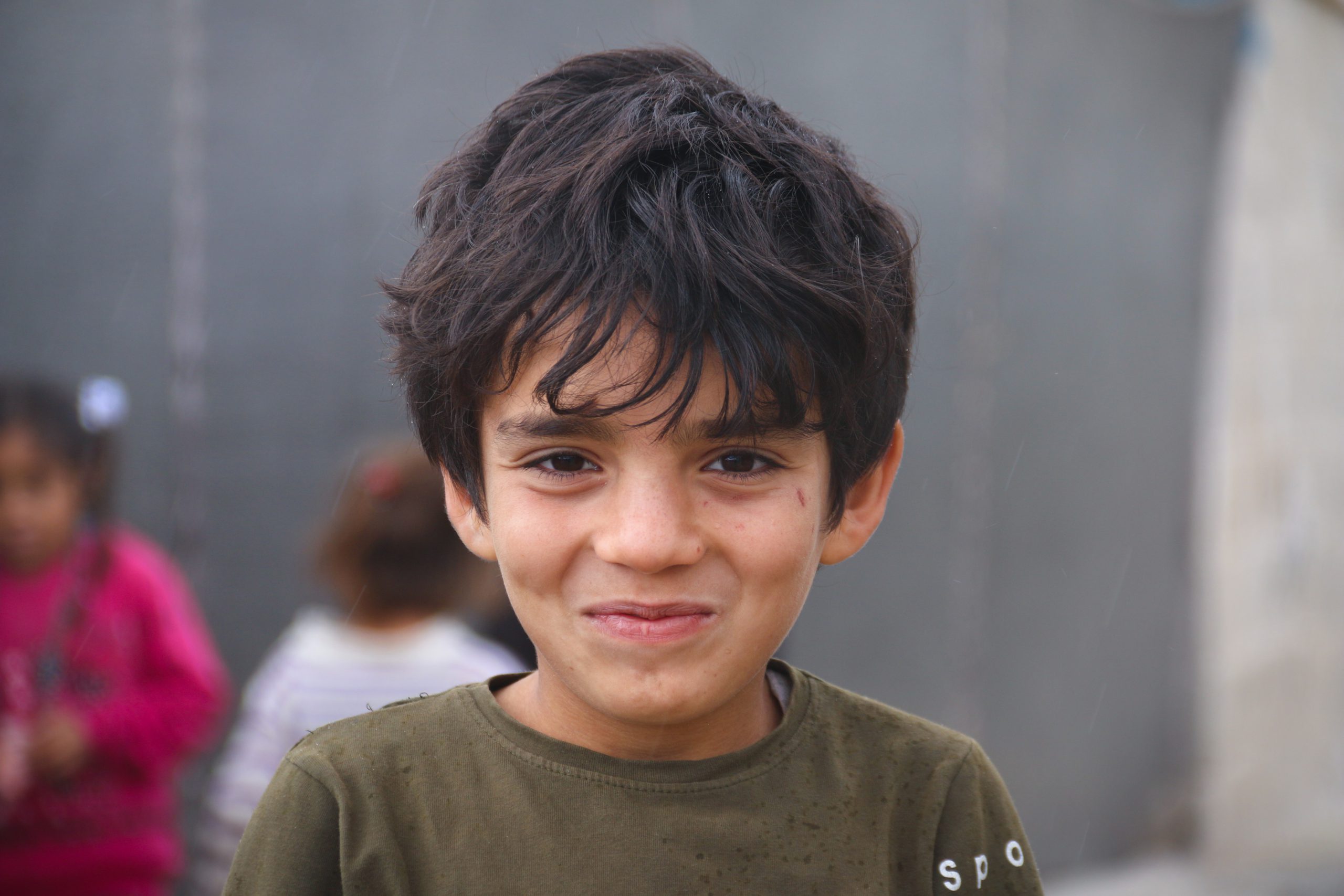 Cute,Syrian,Child,In,A,Refugee,Camp,In,The,Rain. - Humanium