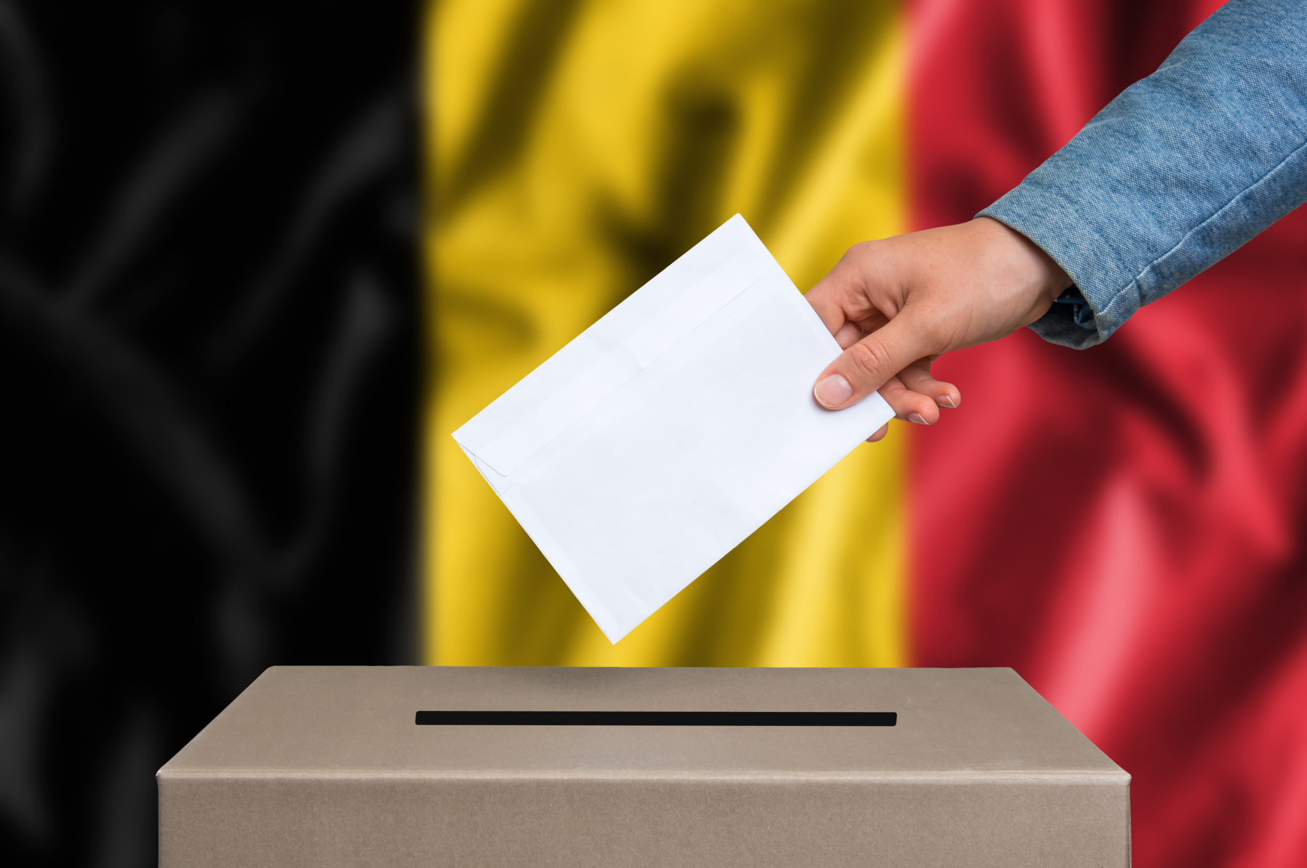 Election,In,Belgium.,The,Hand,Of,Woman,Putting,Her,Vote - Humanium