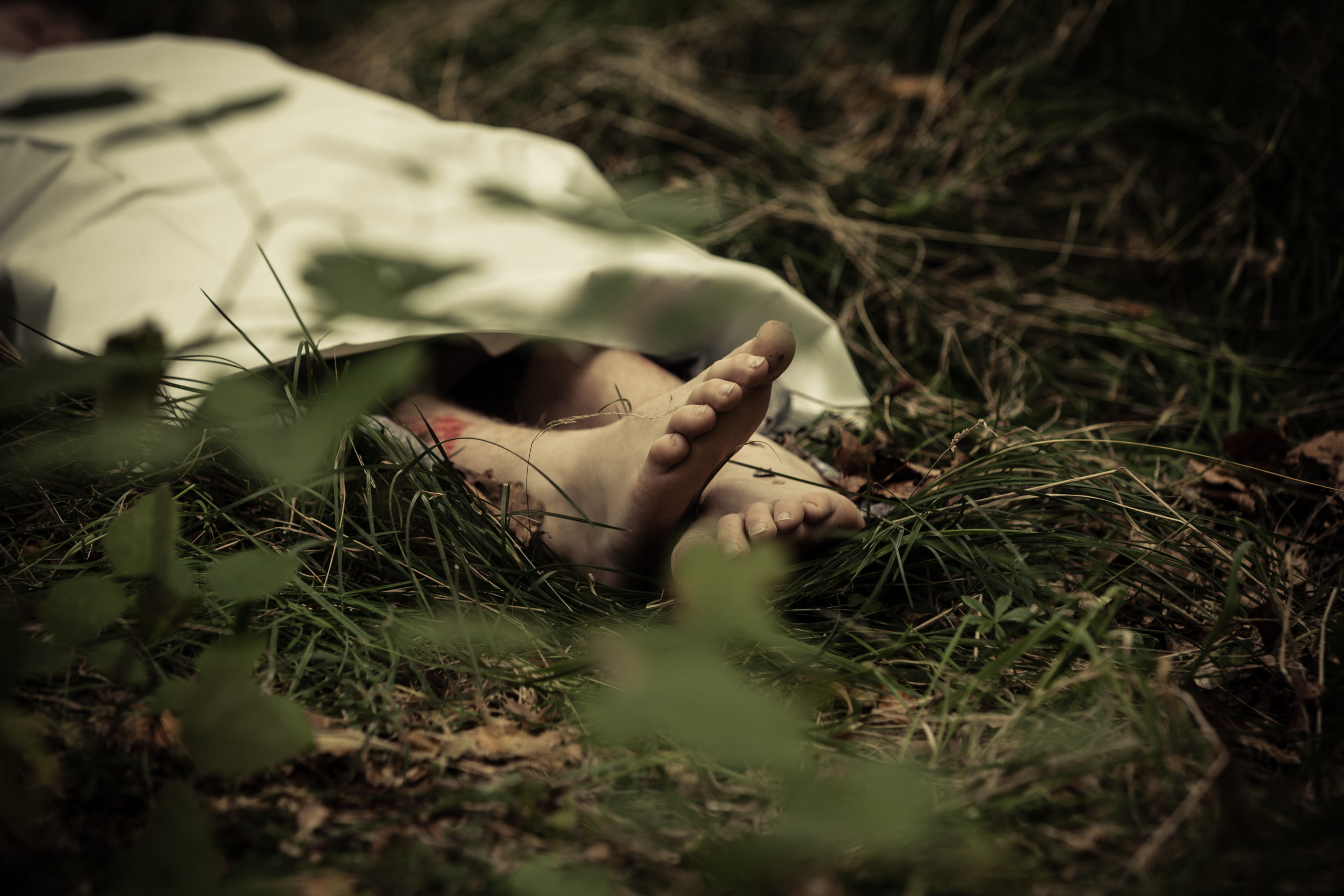 Lower,Body,Of,Abandoned,Murder,Victim,In,Dark,Countryside,With - Humanium
